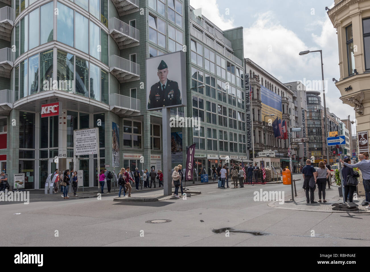 Soldiers at Checkpoint Charlie the best known Berlin Wall crossing ...