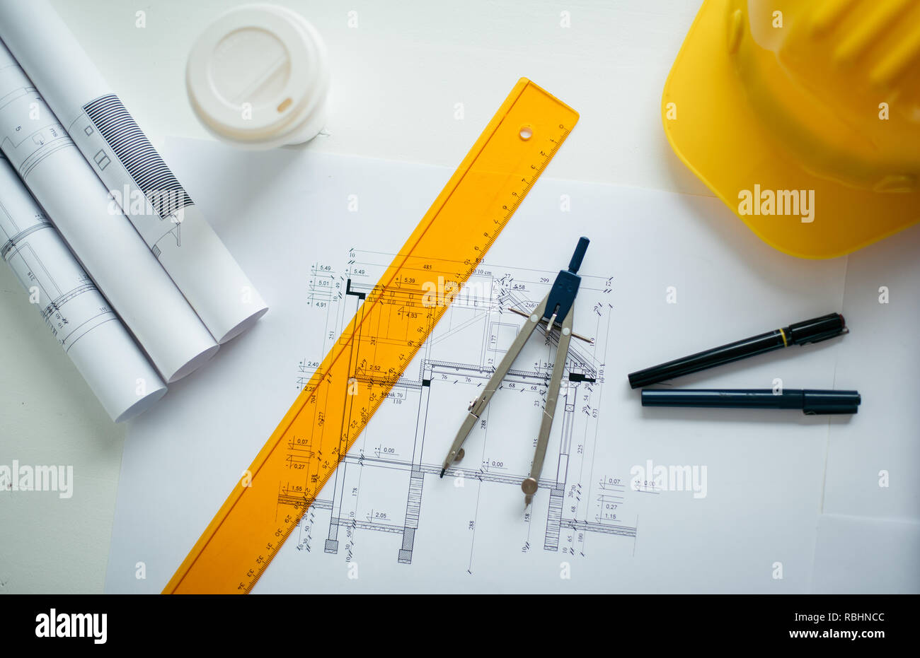 Engineers equipment and blueprints on the office desk. Construction ...