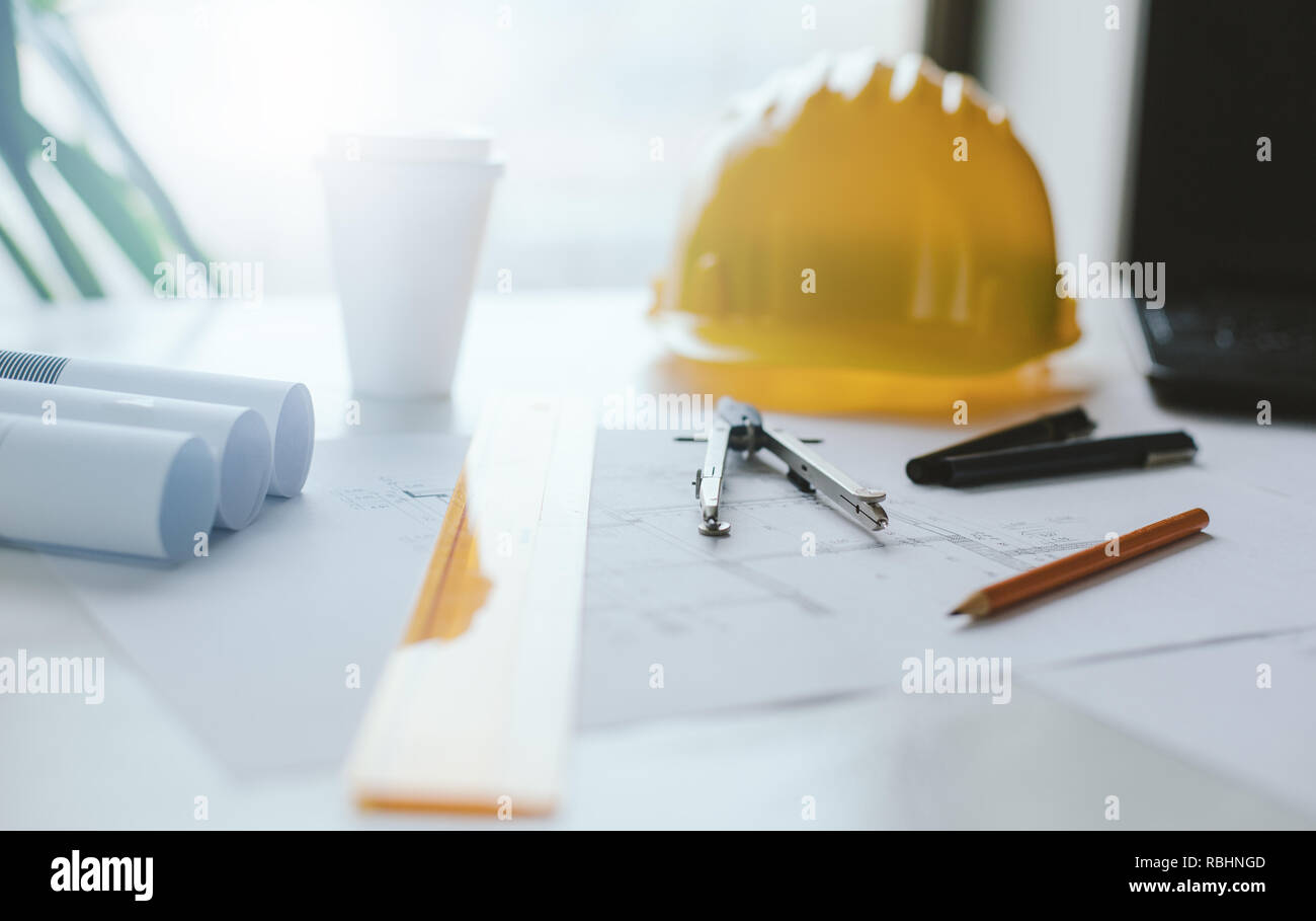Engineers equipment and blueprints on the office desk. Construction ...