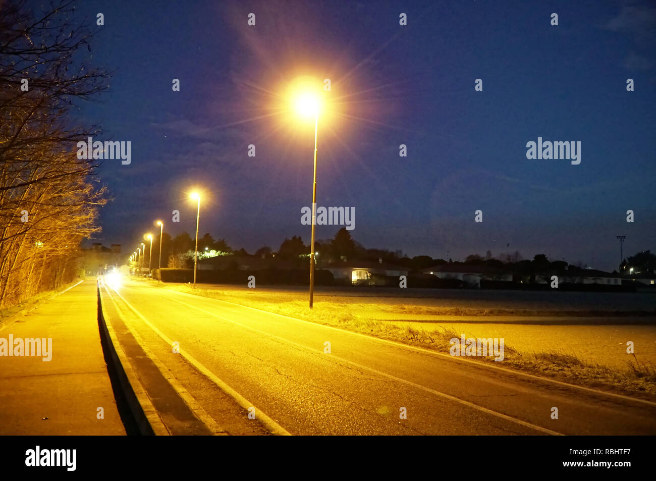 Road lights in night, street post shadow Stock Photo - Alamy