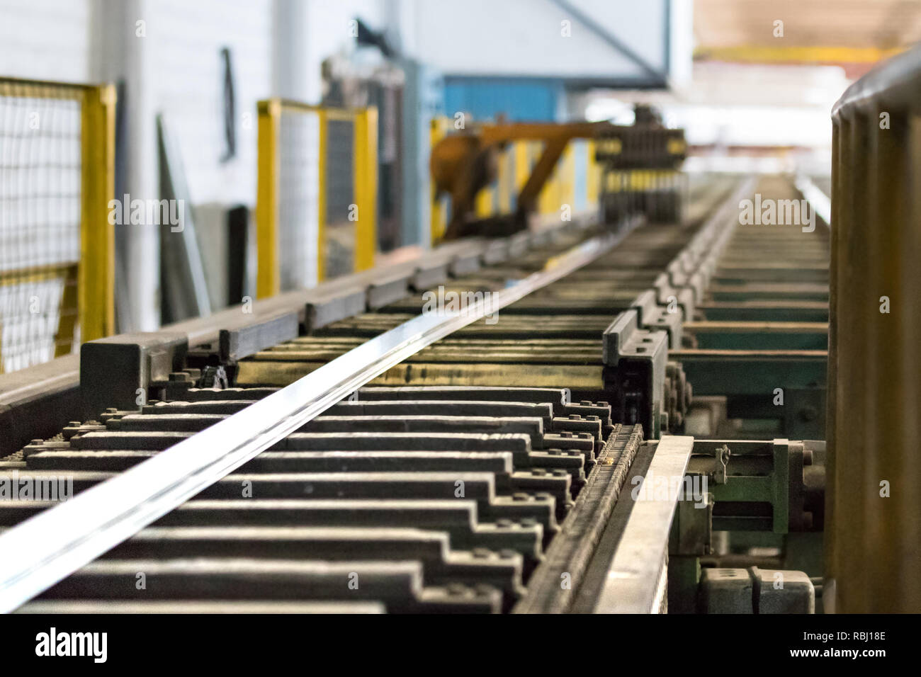 An aluminium profile on the puller stage on an extrusion profile roller ...