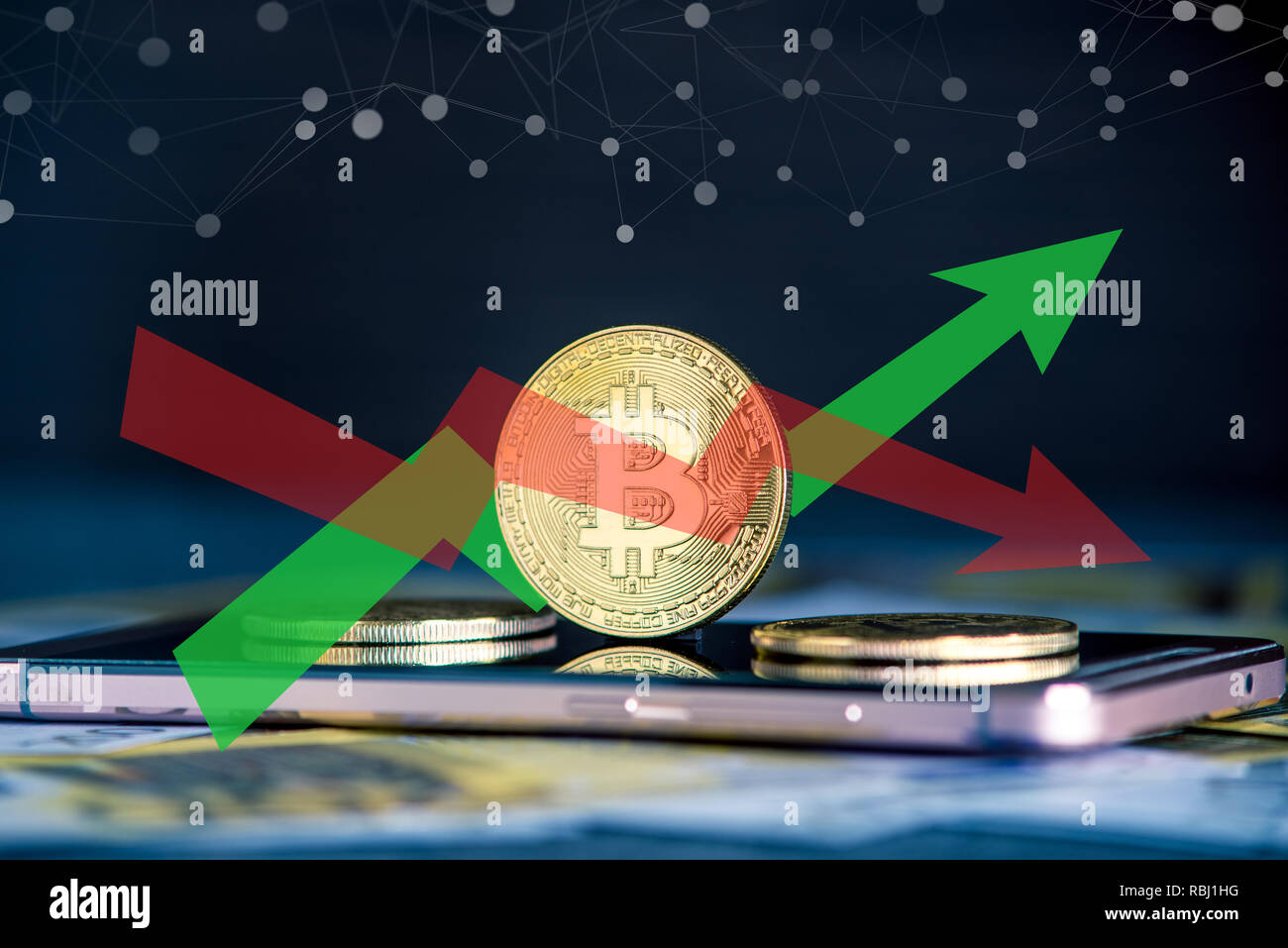 Physical bitcoin coin on the phone screen on the background of the Euro ...
