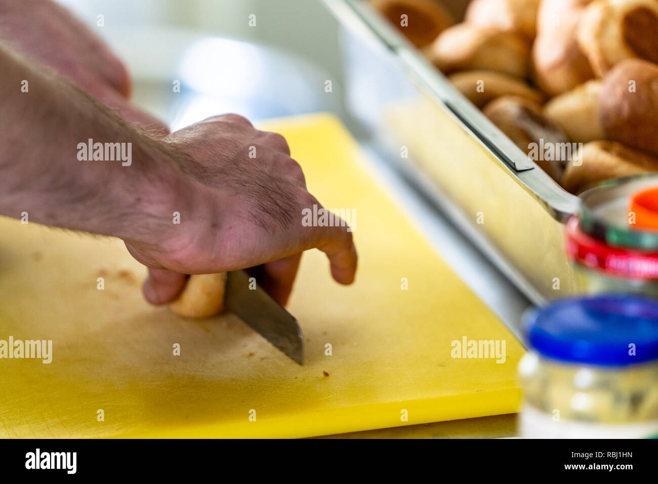 Male cutting bread hi-res stock photography and images - Alamy
