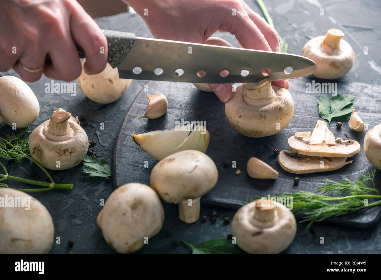 Chef woman cutting fresh champignon hi-res stock photography and images ...