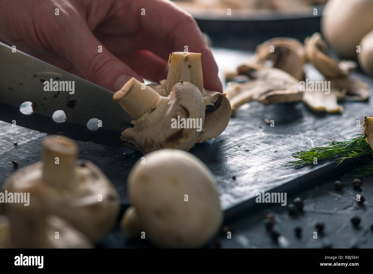 Chef woman cutting fresh champignon hi-res stock photography and images ...