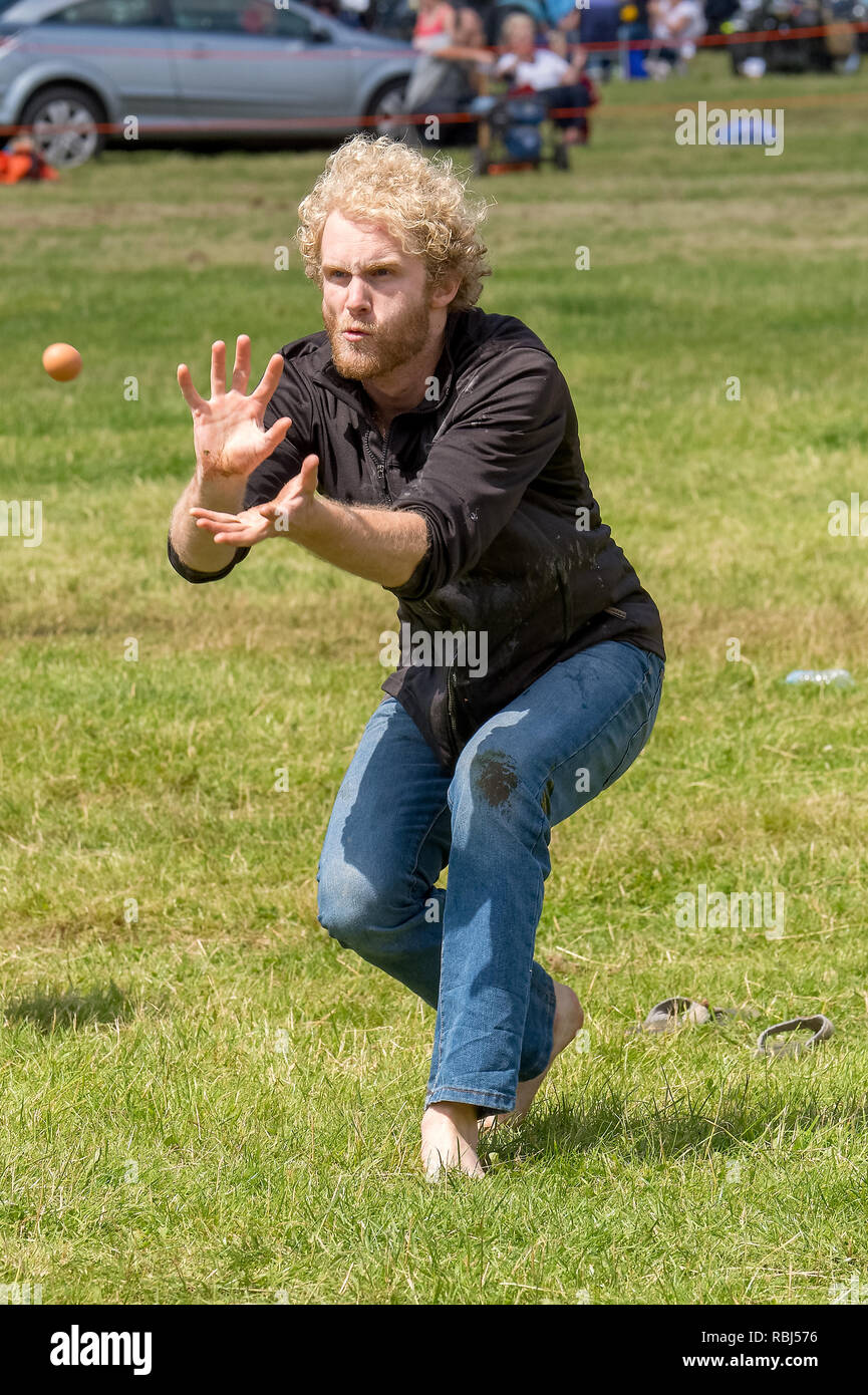 Participant Attempting To Catch A Raw Egg At The World Egg Throwing ...