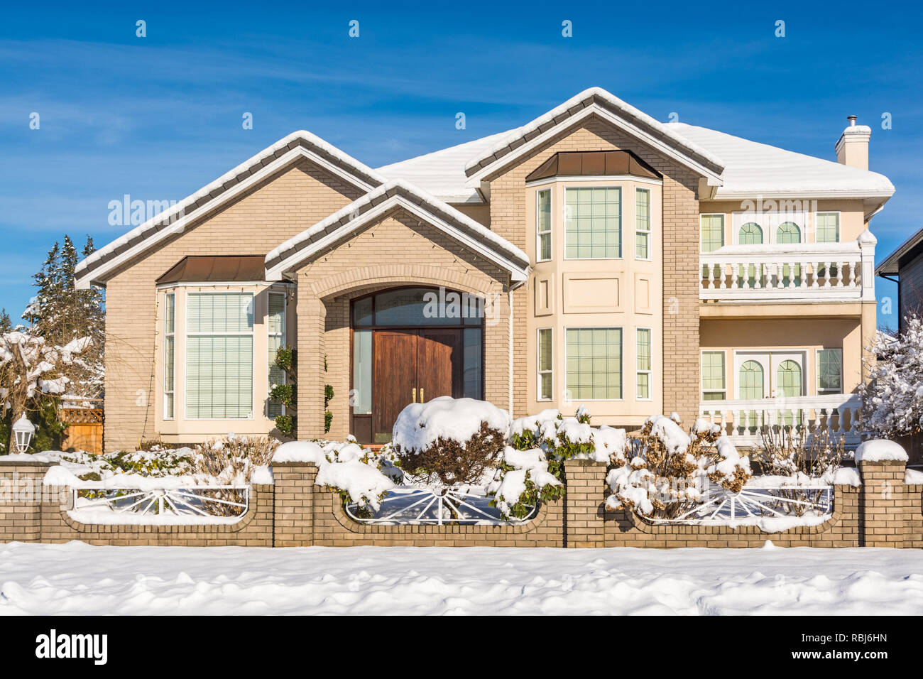 Big luxury residential house in winter season. North American family ...