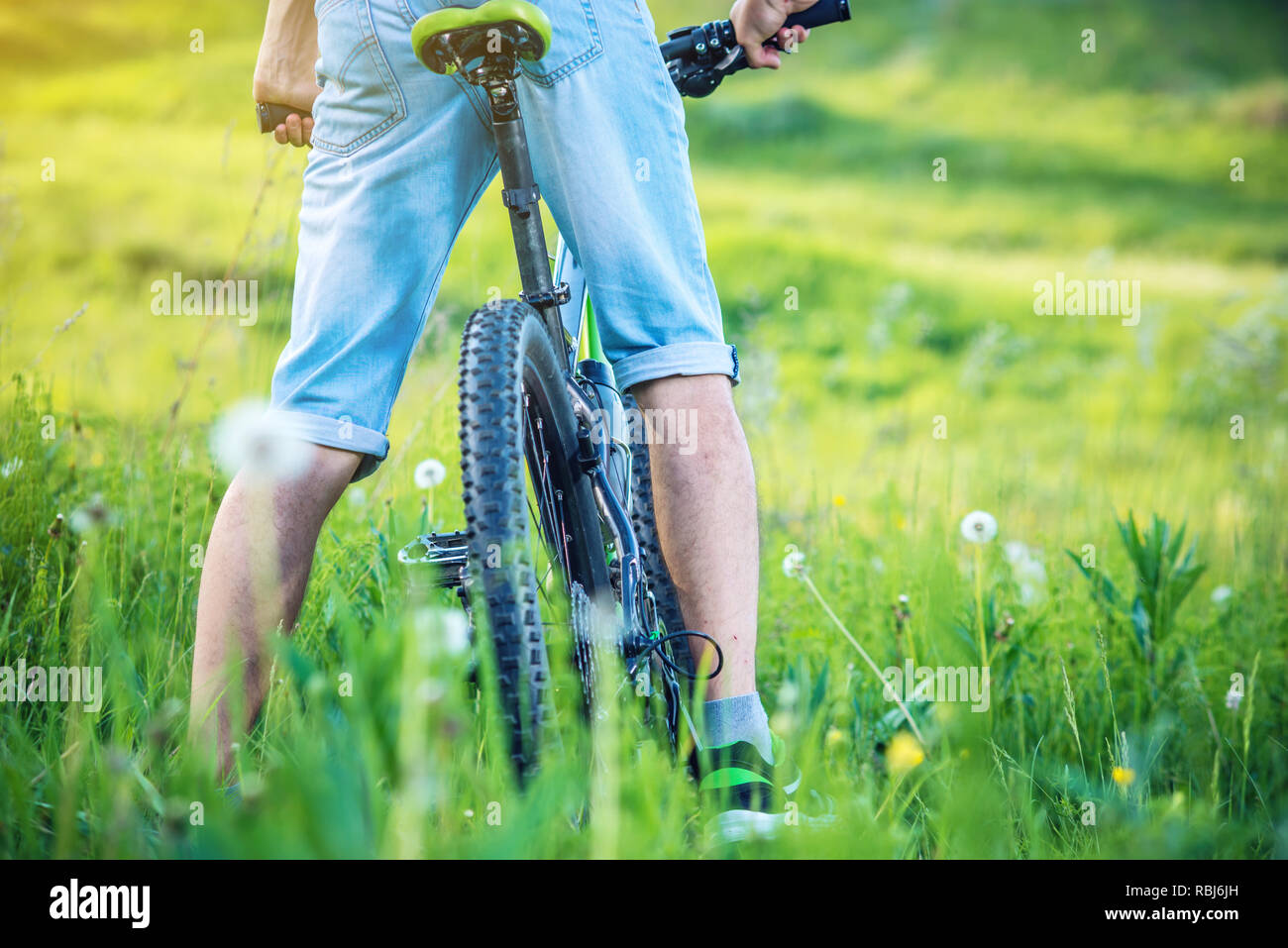 Back view cyclist riding on hi-res stock photography and images - Alamy