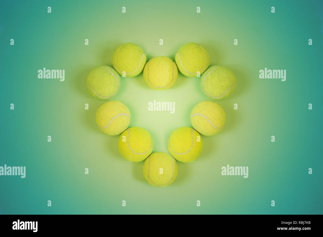 Tennis Balls in Heart Shape Love Stock Photo - Alamy