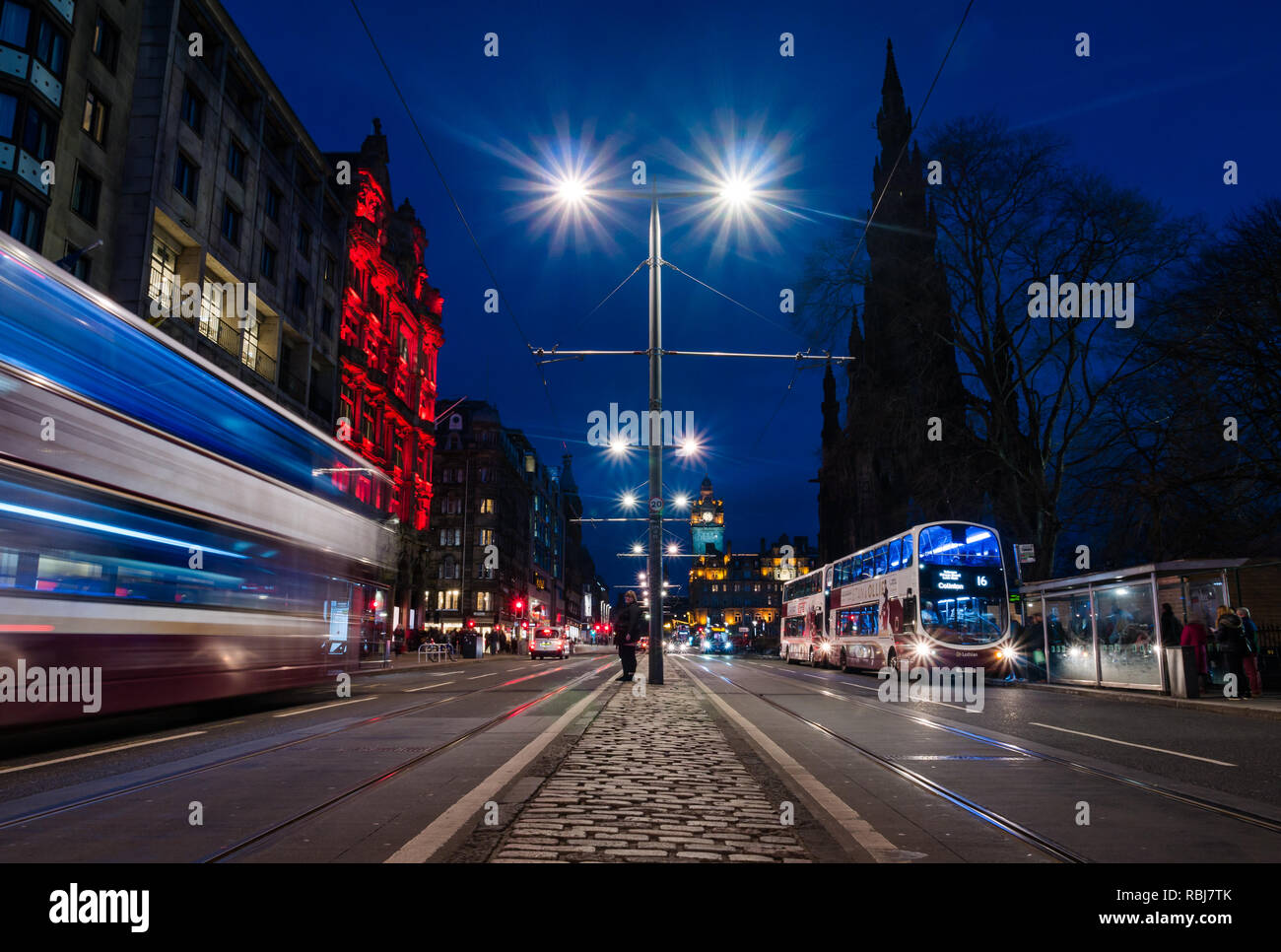 Princes Street at night at rush hour with traffic, Balmoral Clock and ...