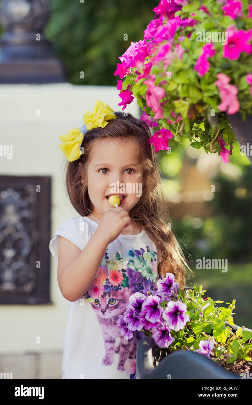 adorable little baby girl with pout tiny lips and brunette hairs posing ...