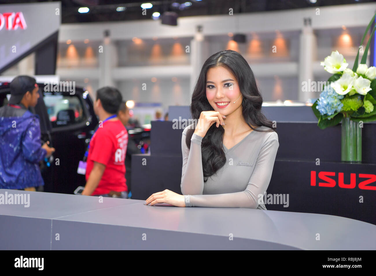 NONTHABURI - NOVEMBER 28: Unidentified model with Isuzu MU-X The Iconic SUV on display at The ...