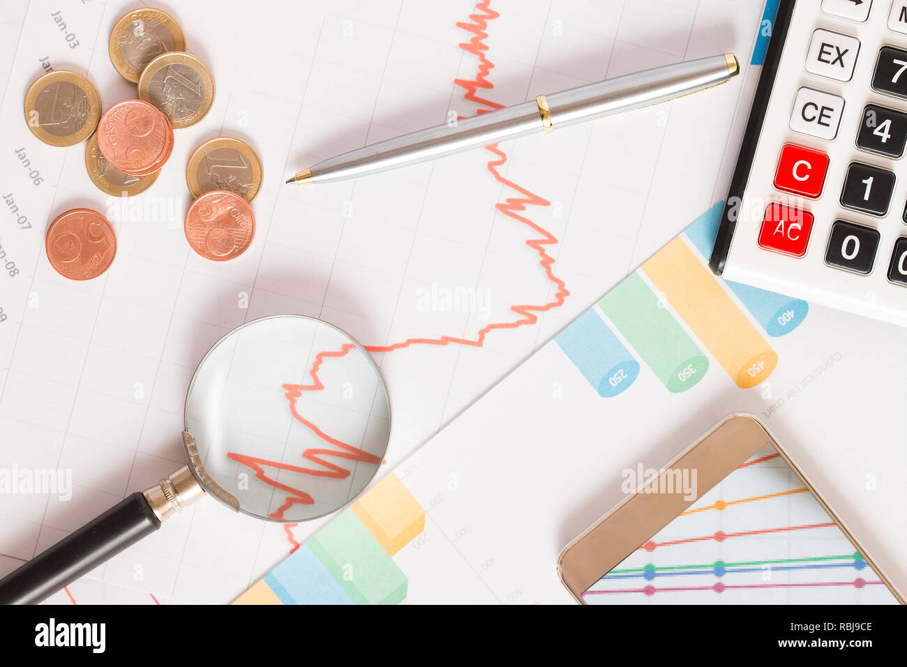 financial success charts and coin Stock Photo - Alamy