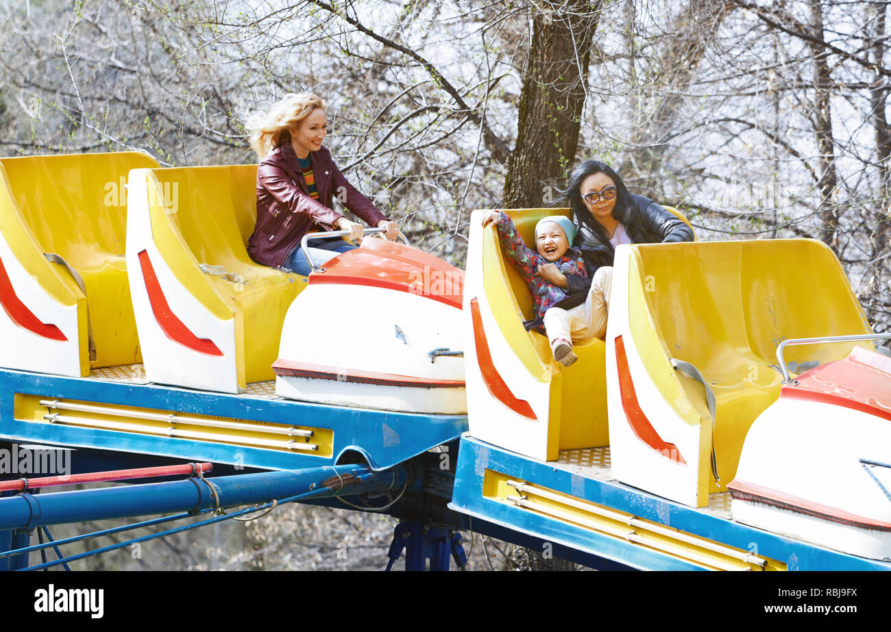 People riding on a rollercoaster Stock Photo - Alamy