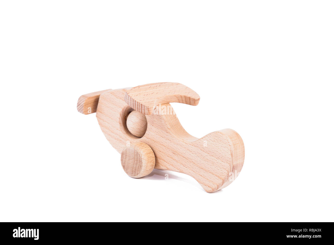 Photo of a wooden plane of beech. Toy made of wood retro aircraft on a ...