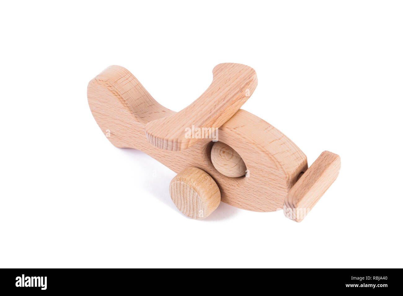 Photo of a wooden plane of beech. Toy made of wood retro aircraft on a ...