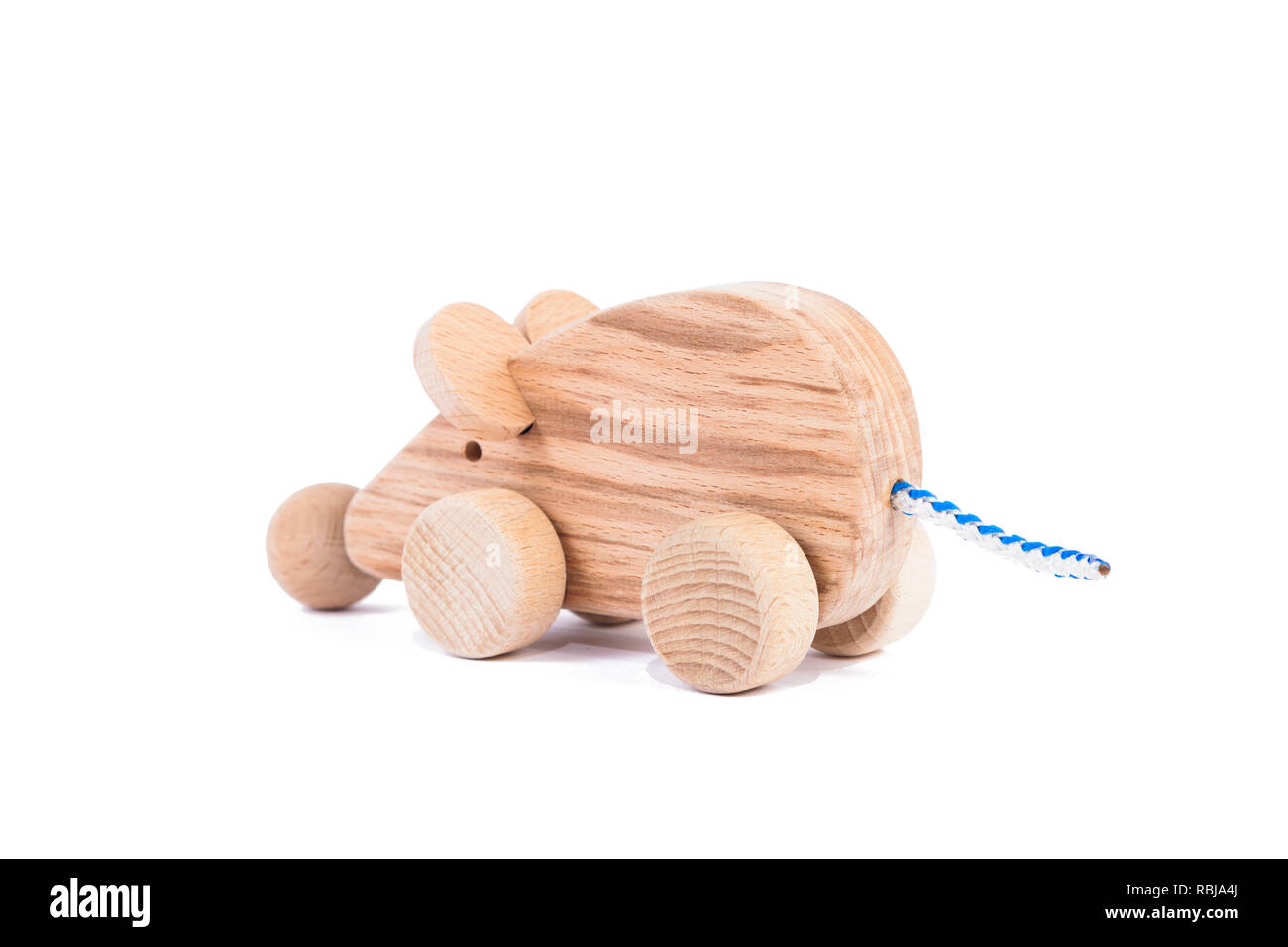 Photo of a wooden mouse on wheels of beech. Toy made of wood mouse car ...