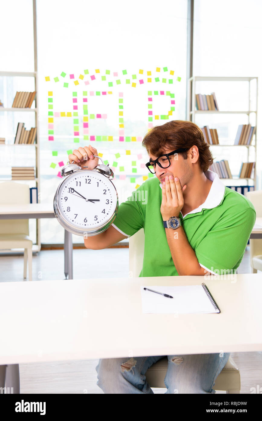 Student struggling at the exam in classroom Stock Photo - Alamy