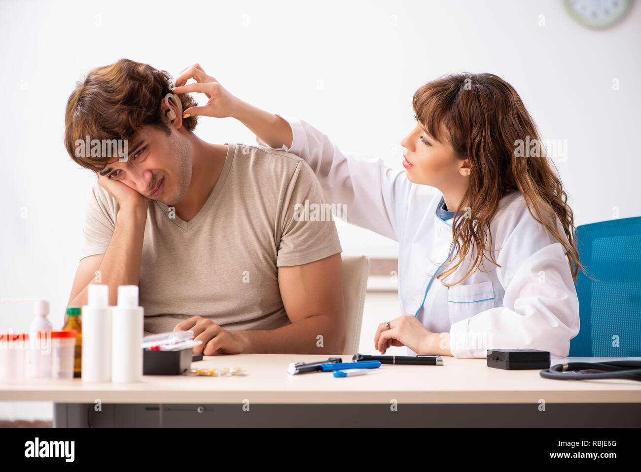 Patient with hearing problem visiting doctor otorhinolaryngologist ...