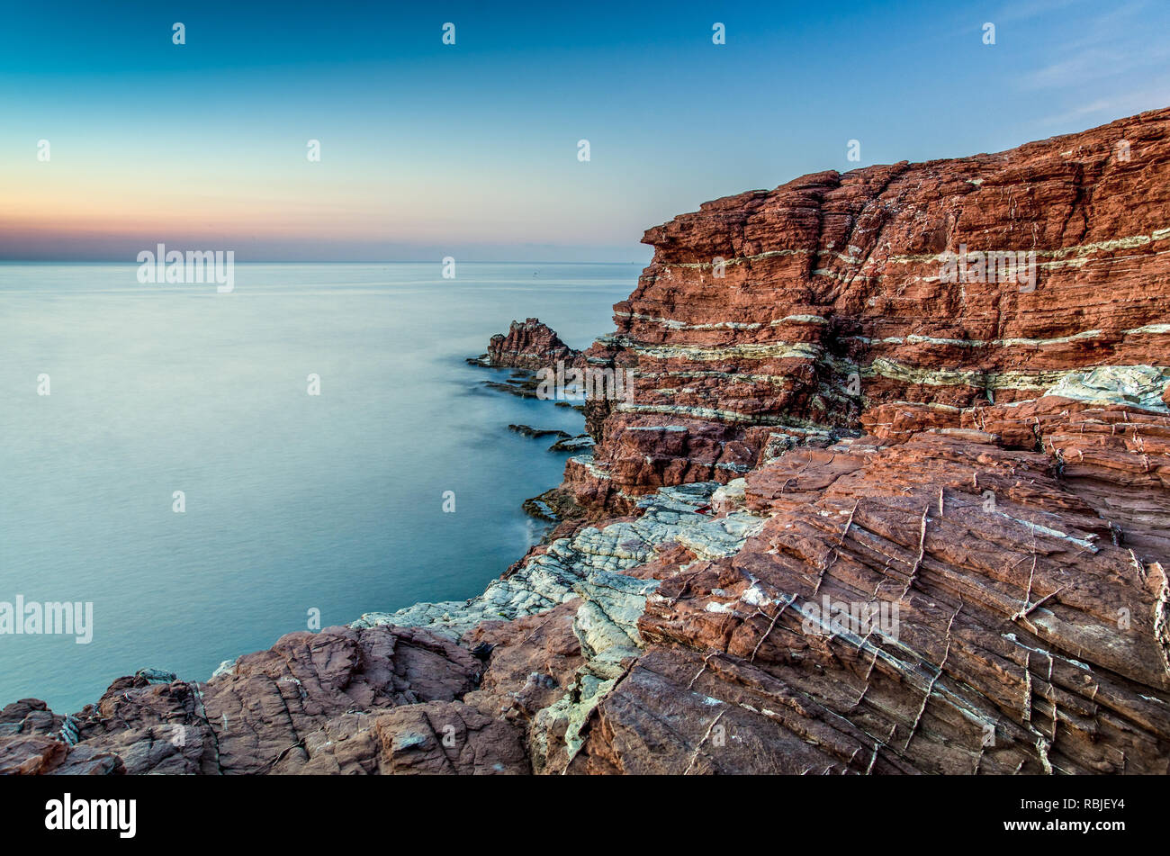 Typical red rock formations of Cala Rossa in Terrasini, Province of ...