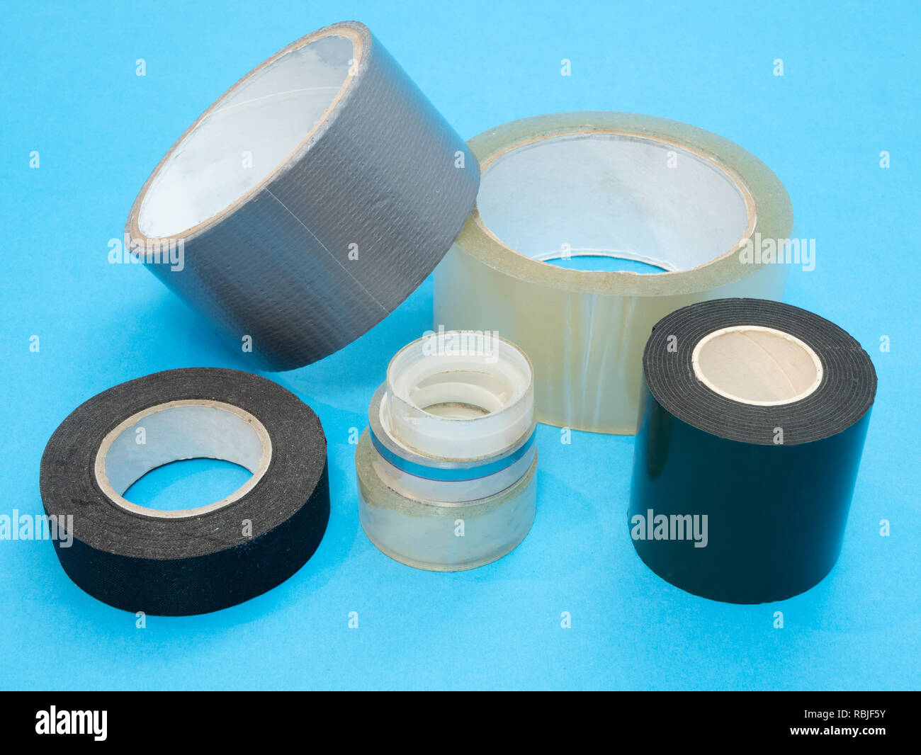 heap pile of rolls packing sticky duct tape various size and different ...