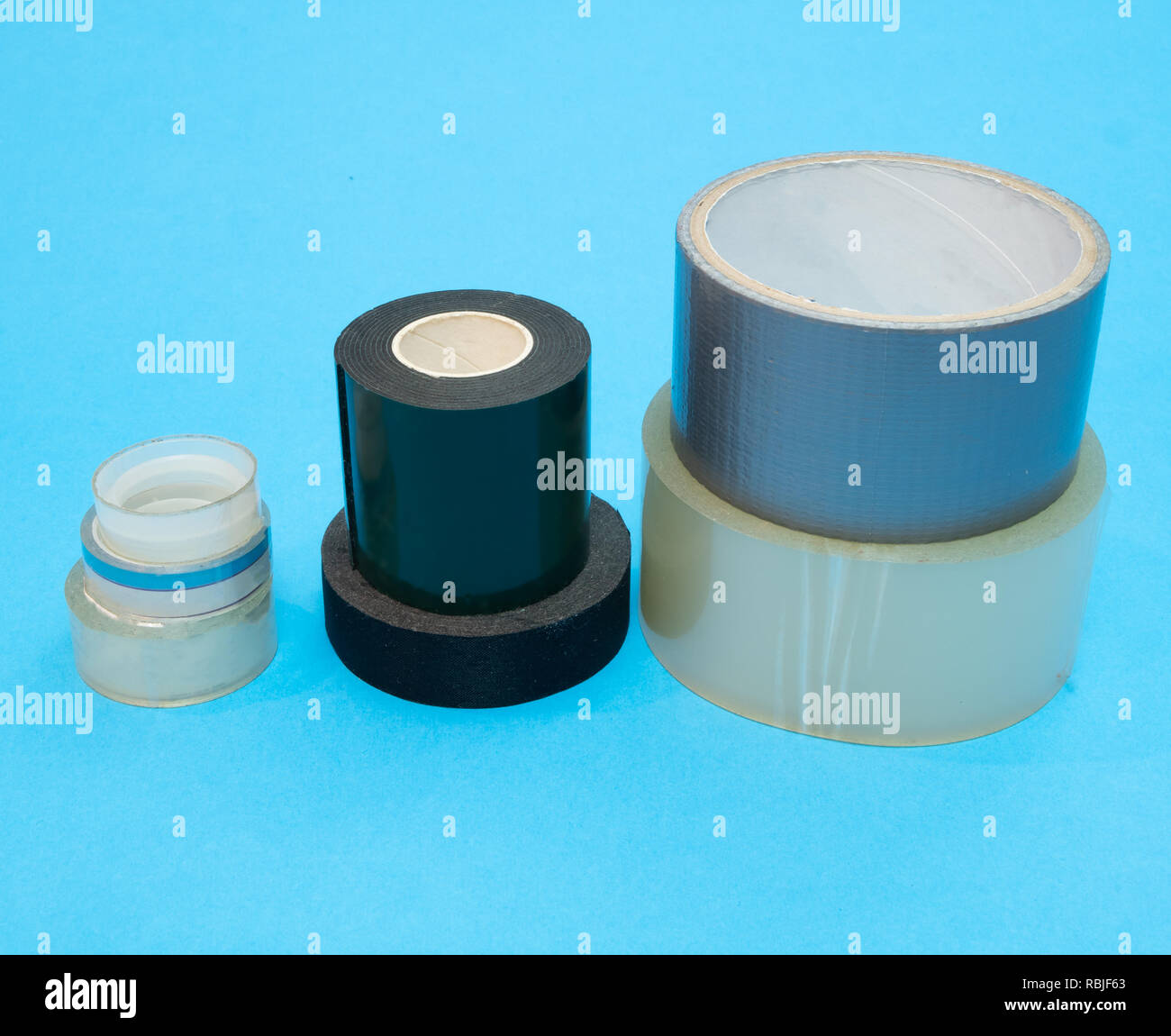 closeup of three stacks of different duct tapes for various purposes ...