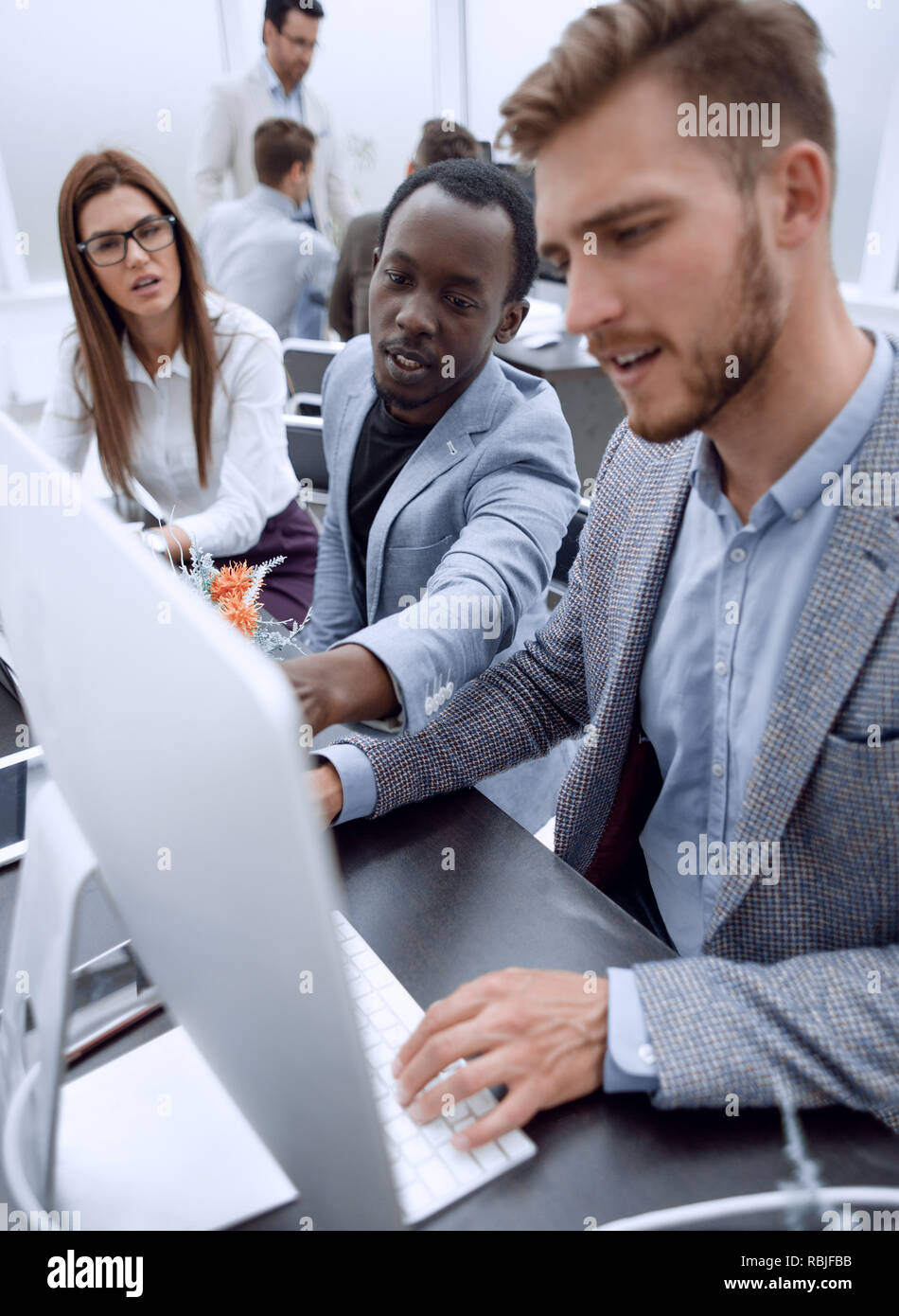 young businessman using a computer in the workplace Stock Photo - Alamy