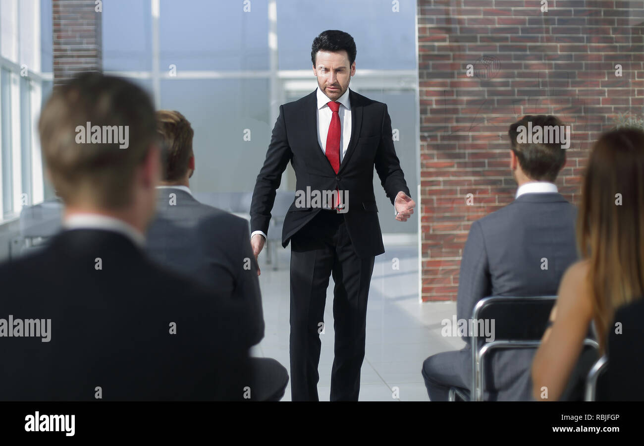 businessman holds a briefing for the business team Stock Photo - Alamy