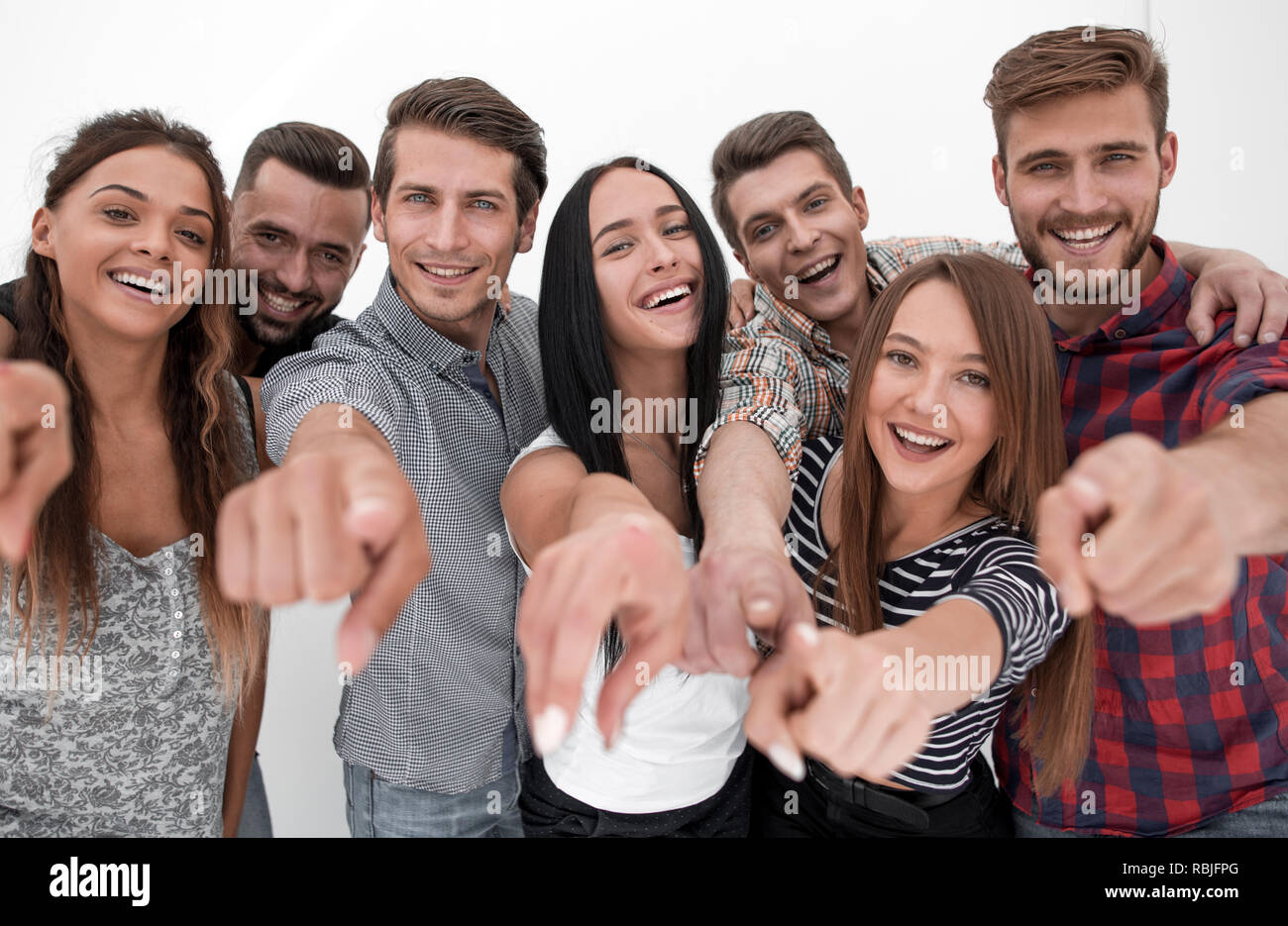 close up.a fun team of young people pointing at you Stock Photo - Alamy