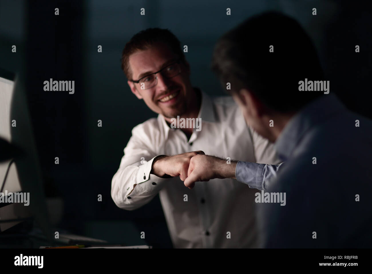 Coworkers fist bump hi-res stock photography and images - Alamy