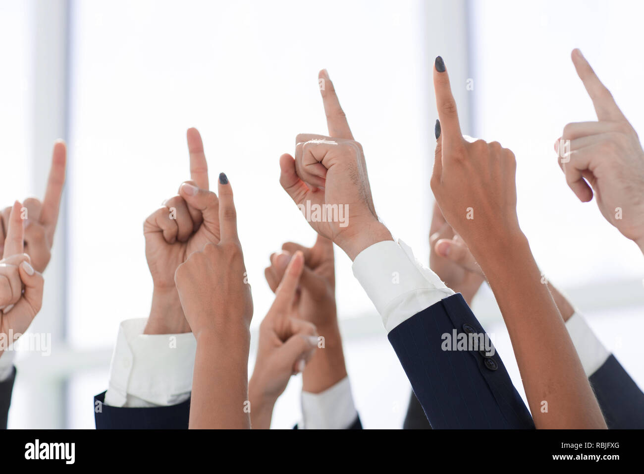 close up. a group of business people pointing up somewhere Stock Photo ...