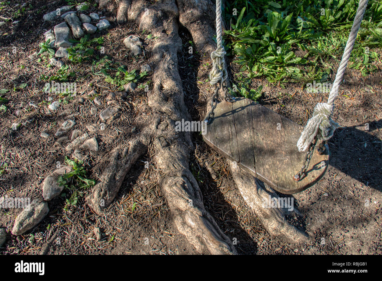 Traditional wooden swing tied hi-res stock photography and images - Alamy