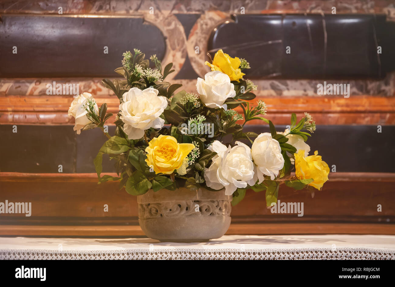 Altar decoration with yellow and red roses Stock Photo - Alamy