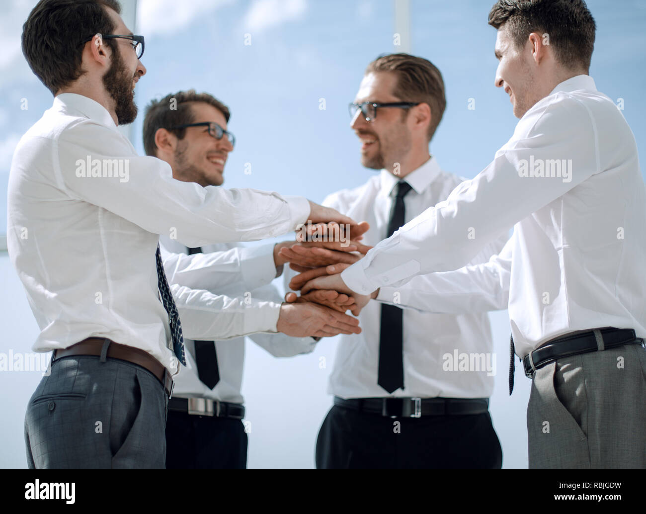 close up.a group of business people folded their hands together Stock ...