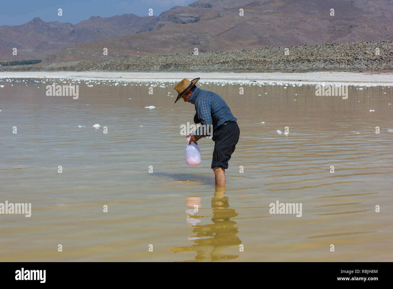 Man picking up from floor hi-res stock photography and images - Alamy