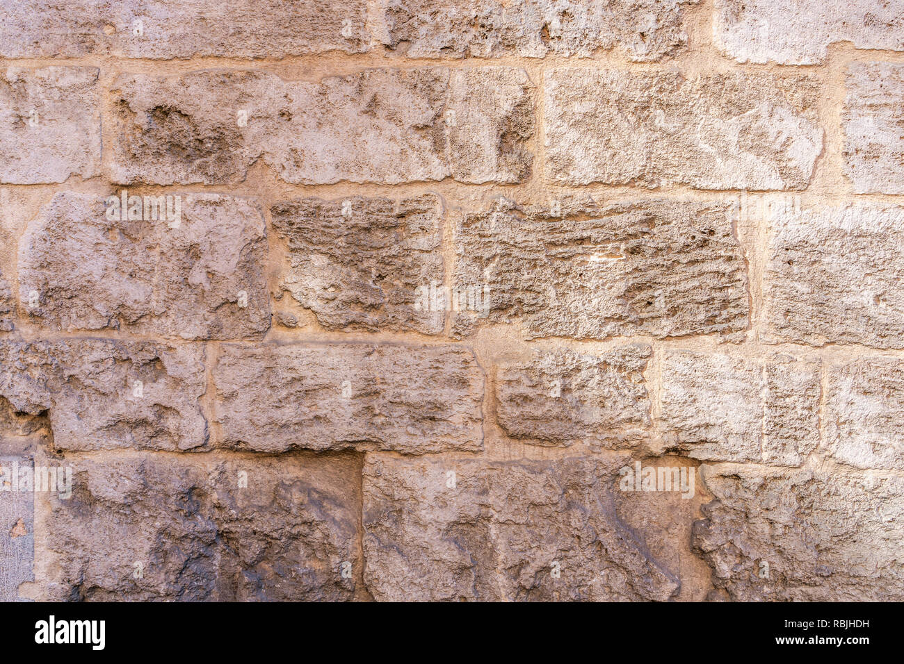 Ancient, medieval brick and stone wall. Mediterranean style. Spanish ...