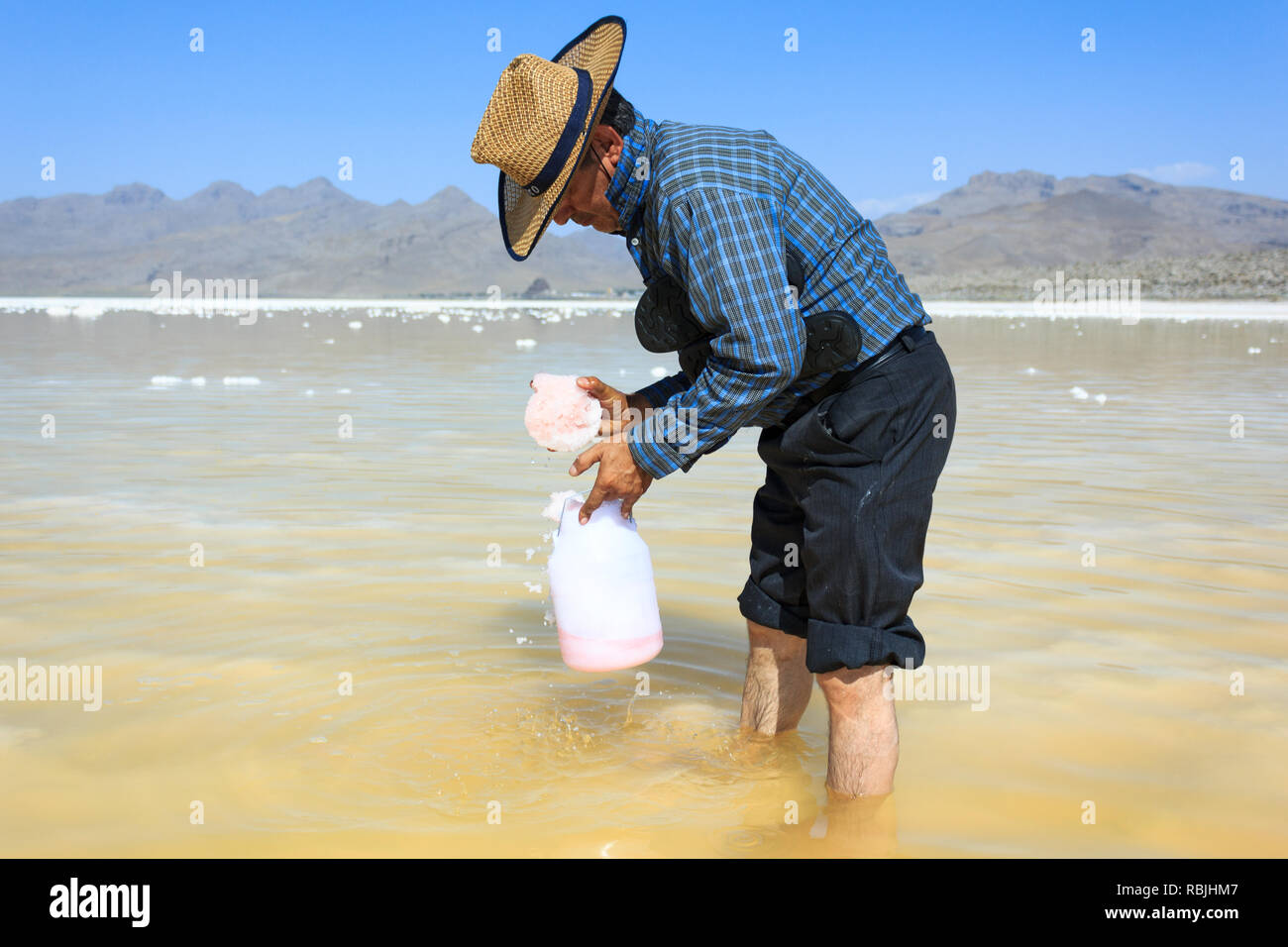 Man picking up from floor hi-res stock photography and images - Alamy