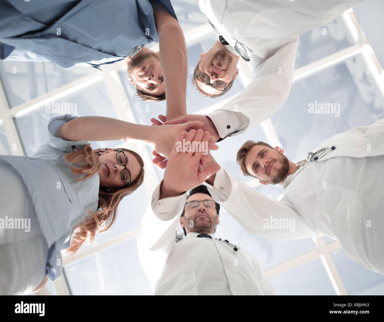 Portrait of a doctor team connecting hands stacking Stock Photo - Alamy