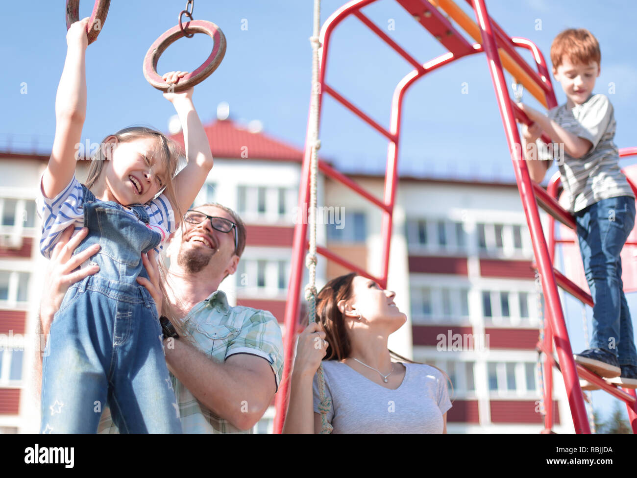 young family with children playing in the Playground Stock Photo - Alamy