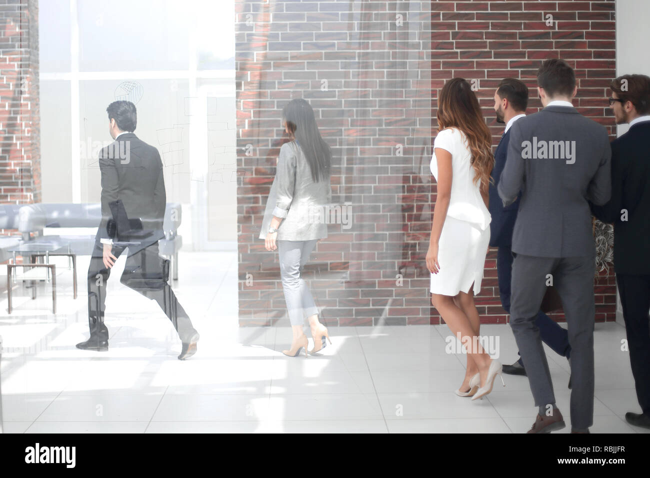 Businessman businesswoman walk through modern hi-res stock photography ...
