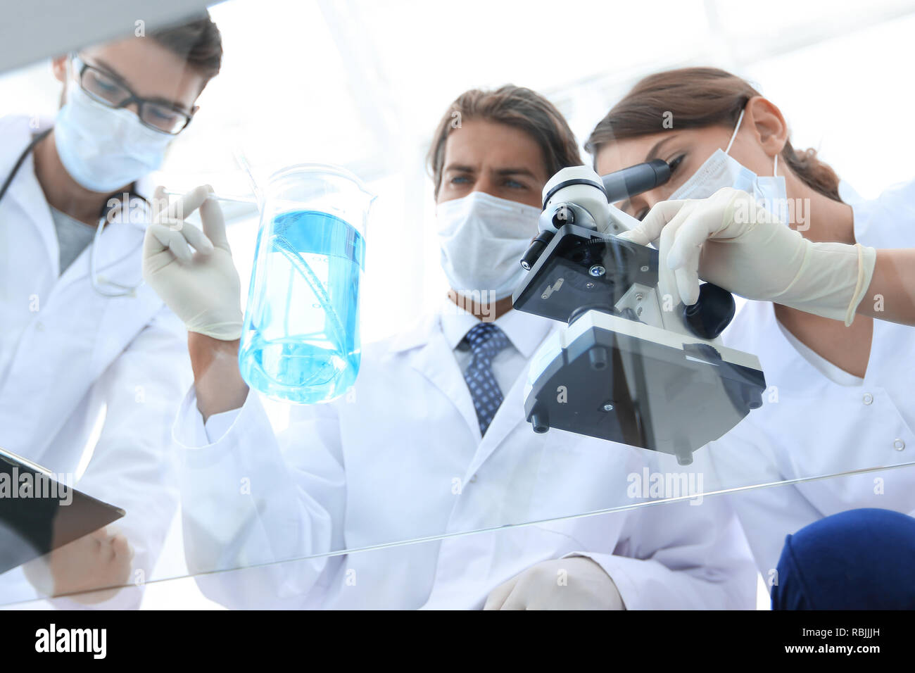 scientists conducting research in a lab environment Stock Photo - Alamy