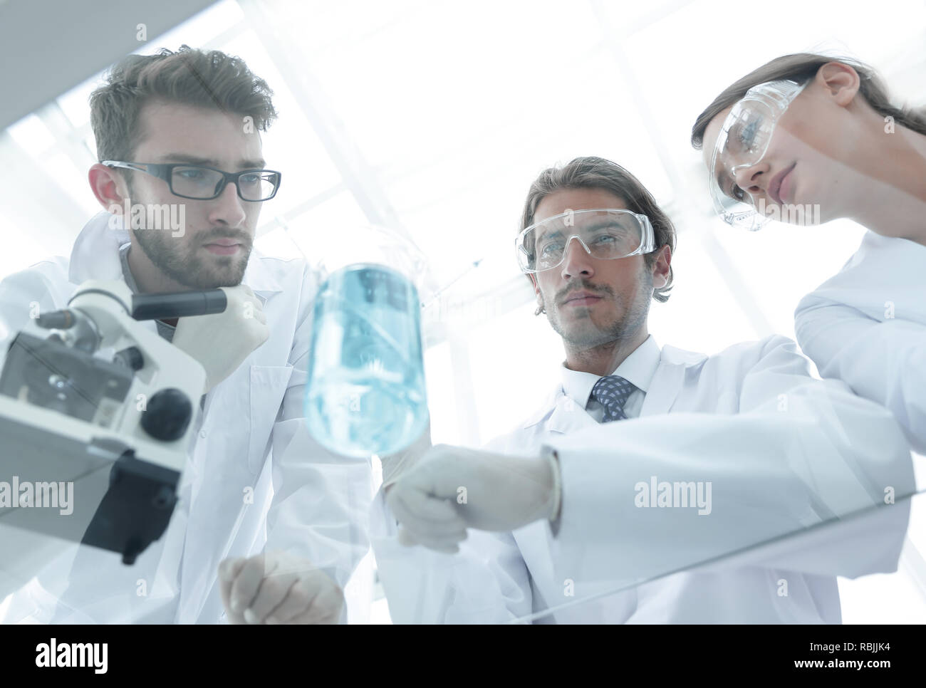Group of scientists working on an experiment at the laboratory Stock ...