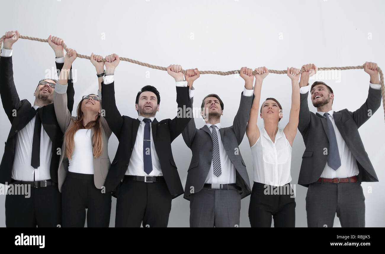 business team holding strong rope Stock Photo - Alamy