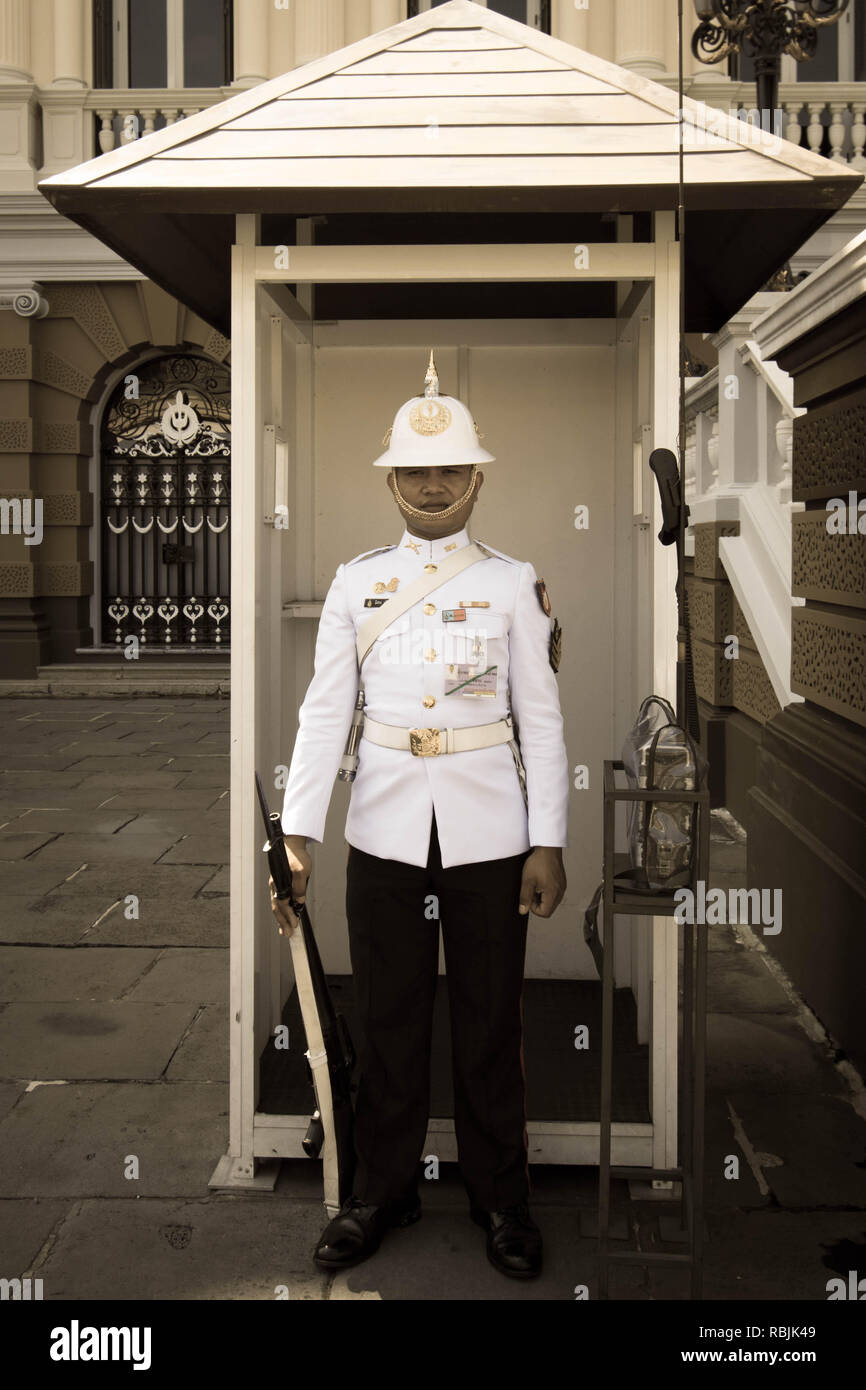 Grand Palace Bangkok soldier in box on guard with riffle and white ...