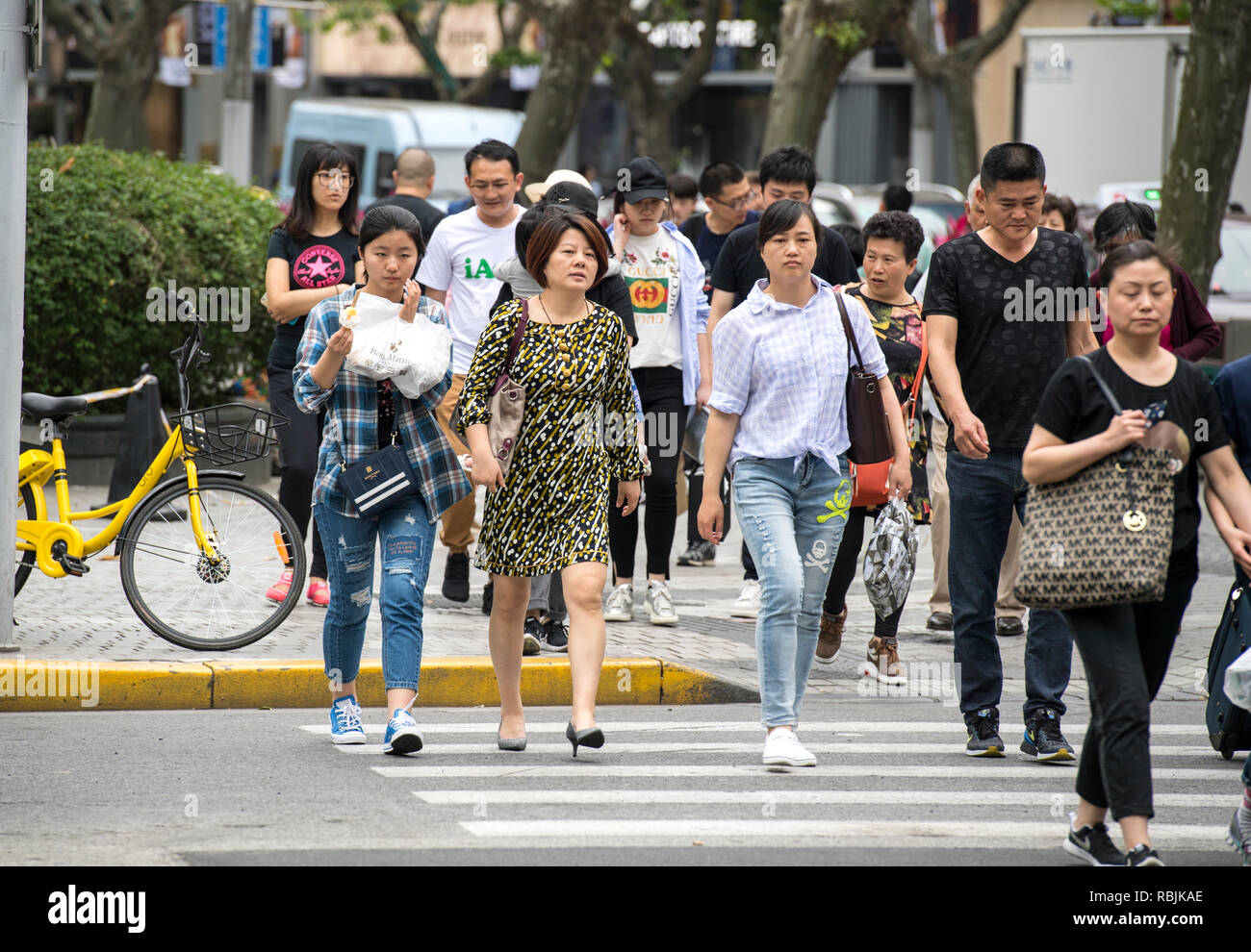 People walking on the streets of Shanghai in China Stock Photo - Alamy
