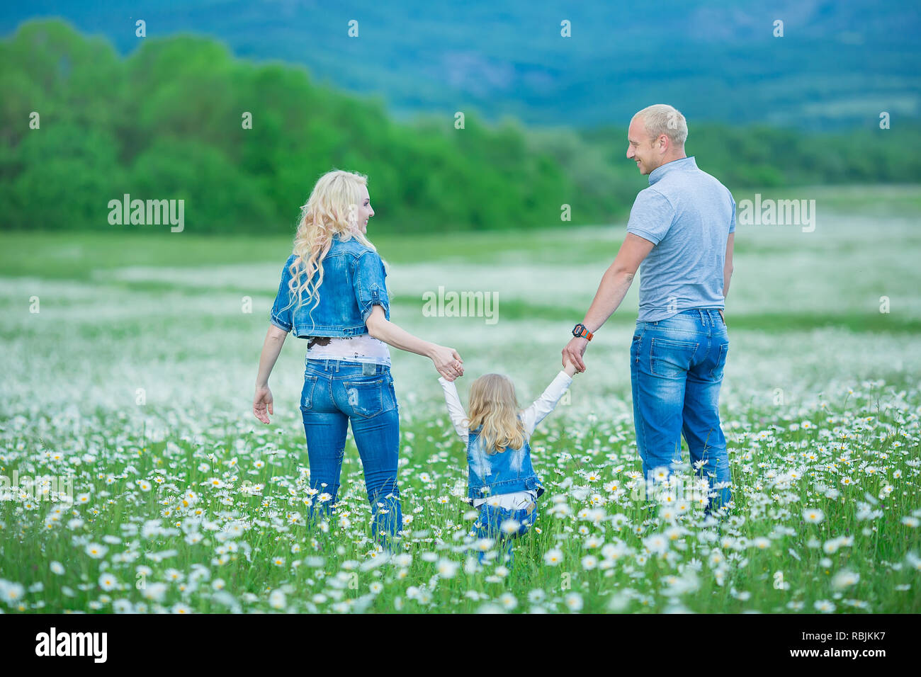 happy family having fun outdoors. Portrait of happy family in ...