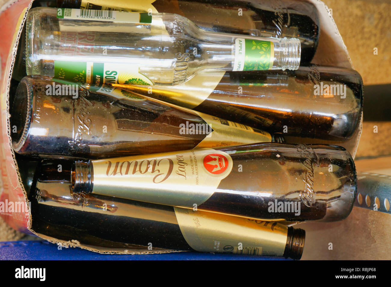 Glass bottles in a box ready to be recycled Stock Photo - Alamy