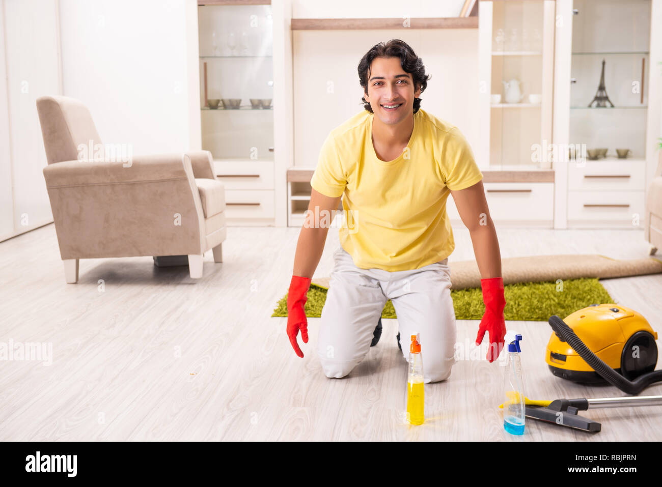 Young handsome man doing housework Stock Photo - Alamy