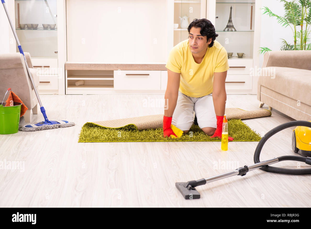 Young handsome man doing housework Stock Photo - Alamy