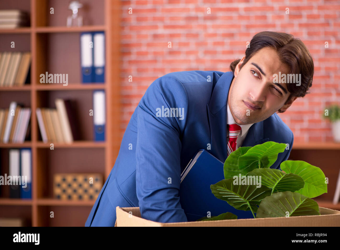 Young person being fired from his work Stock Photo - Alamy